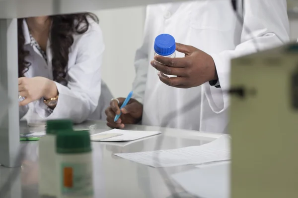 Group of young medical workers are working in lab as lab technic ...