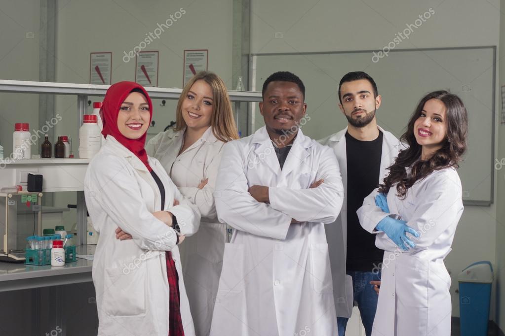 Group of young medical workers are working in lab as lab technic ...