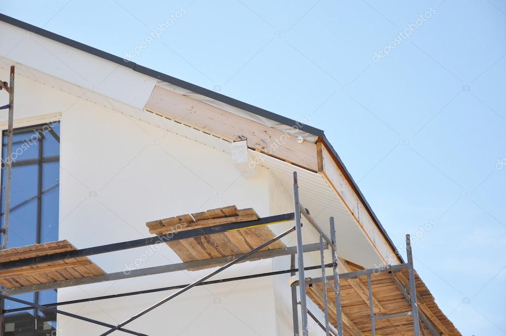 Corner of house with eaves, rafters, truss. Install softies and roof ...
