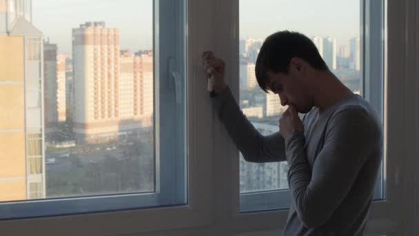 Worried man stand and crying near window — Stock Video © bazava #89579930