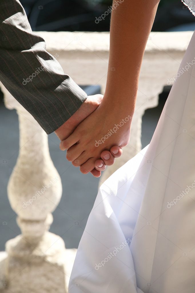 Hands of the bride and groom together — Stock Photo © OlegTroino #98737552