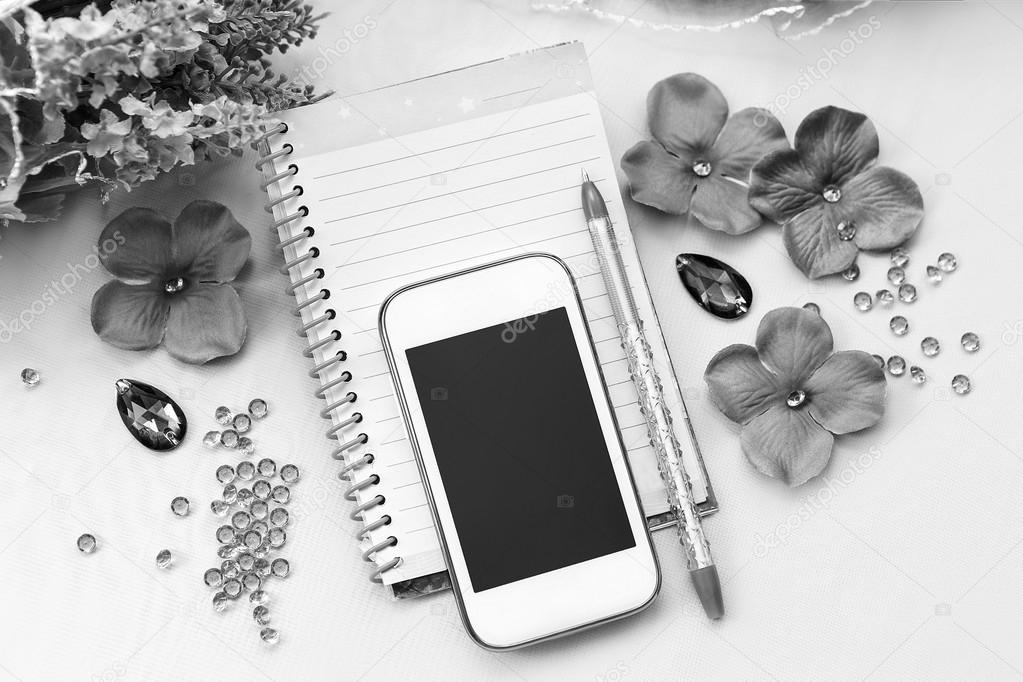 Phone, notebook and pen. Some office stuff on a white background ...