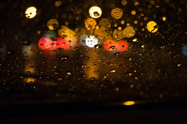 Raindrops on window grass at night - Stock Image - Everypixel