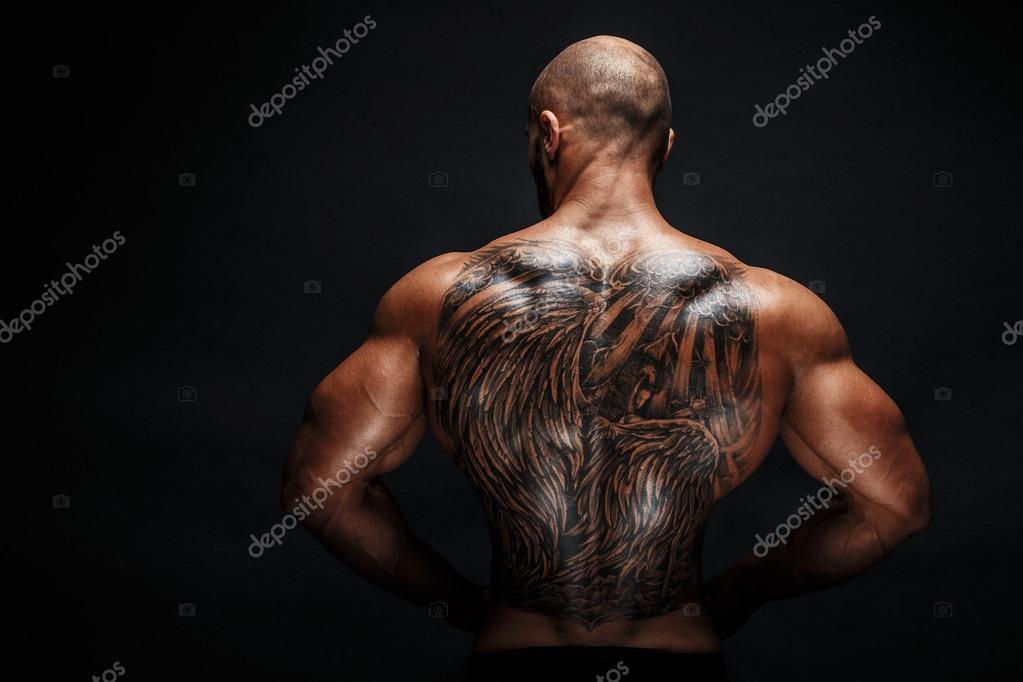 View of tattooed mans back — Stock Photo © zamuruev #112196234 View of tattooed mans back — Stock Photo © zamuruev #112196234