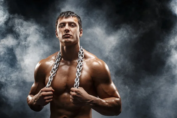 Muscular man with a chain — Stock Photo © Wavebreakmedia #93766256