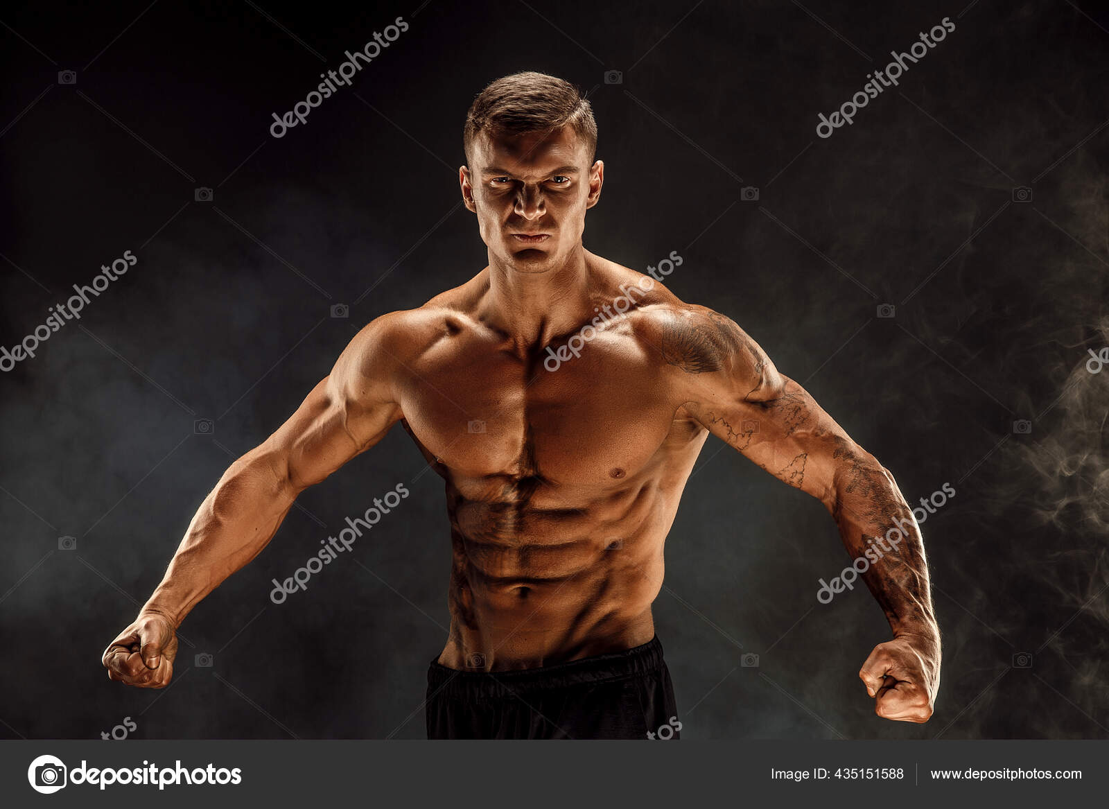 Very brawny guy bodybuilder posing. Beautiful sporty guy male power ...