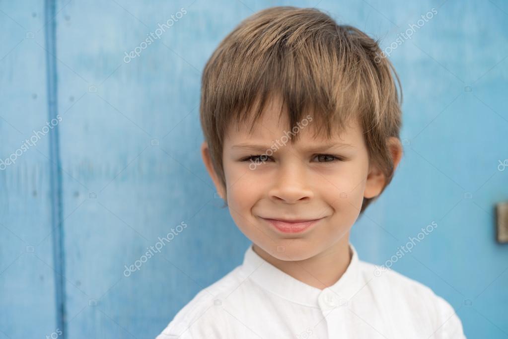 Boy face background blue Stock Photo by ©ClaudioValdes 78088884