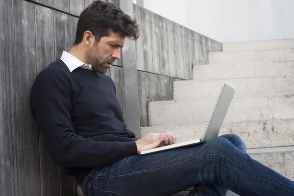Young man watching computer - Stock Image - Everypixel