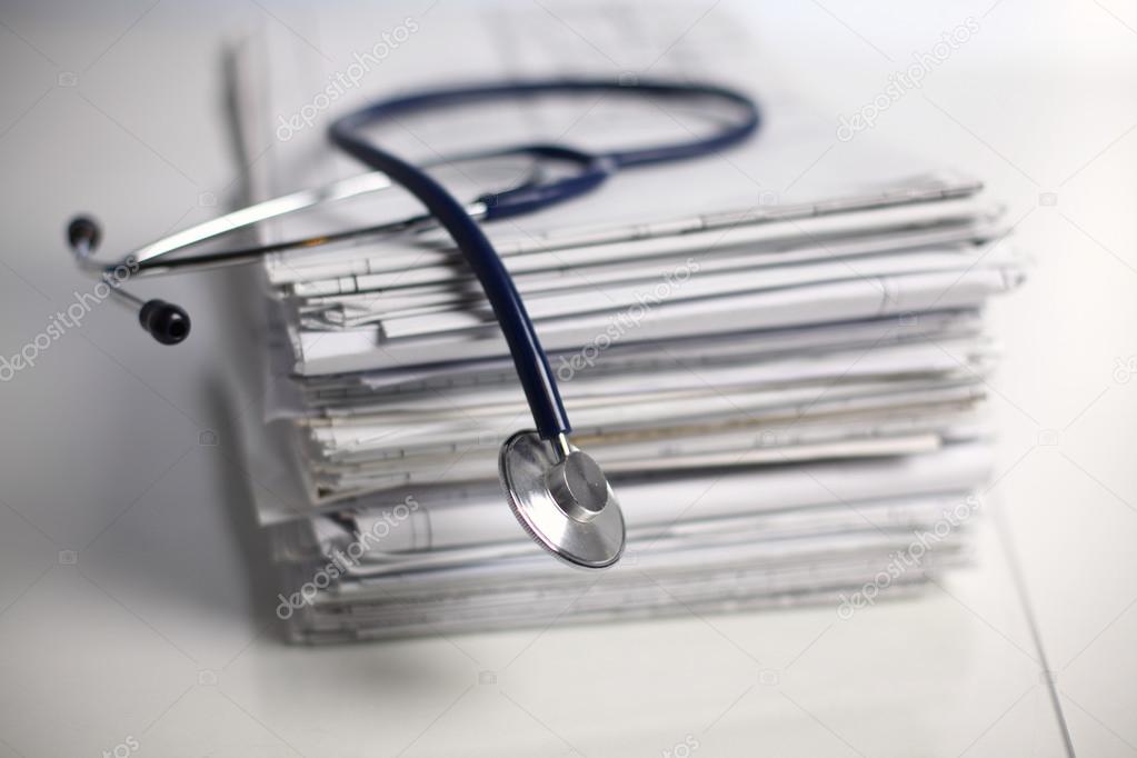 Medical stethoscope on the stack of paper — Stock Photo © lenecnikolai ...