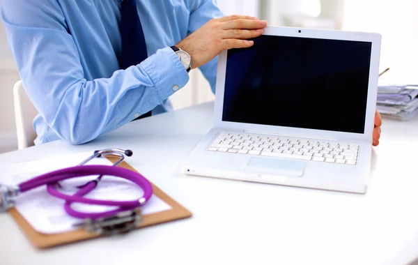 Doctor working with laptop computer in medical workspace office and ...