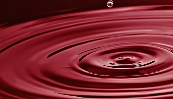 Red Water Splash Stock Photo by ©AGCreativeLab 80527356