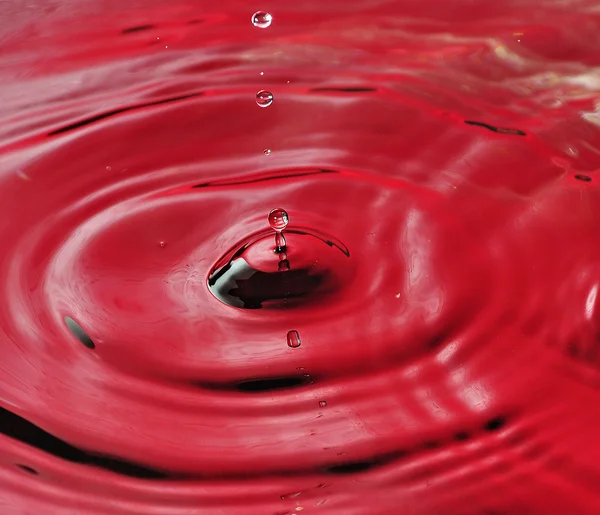 Red Water Splash Stock Photo by ©AGCreativeLab 80527356