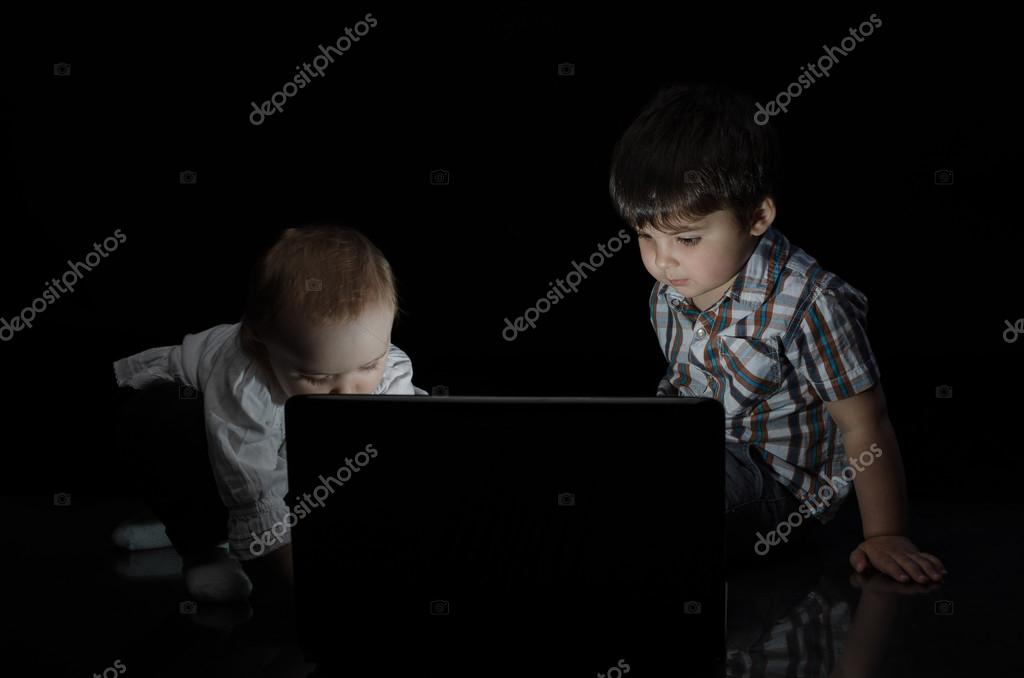 Small children look into the computer — Stock Photo © 5nikolas5 #78521068