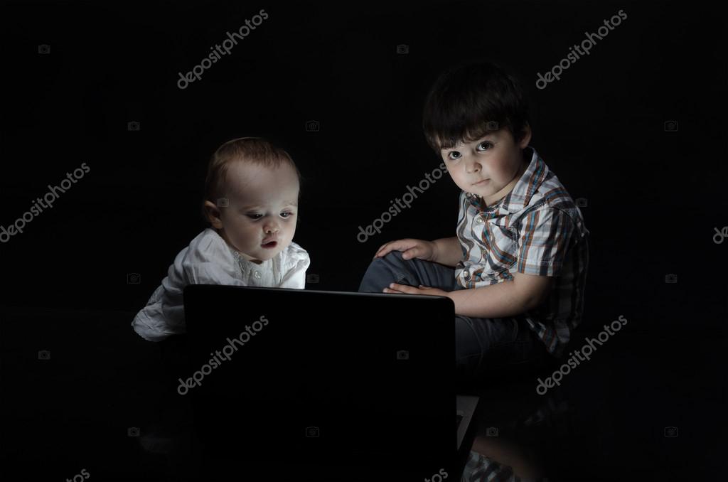Small children look into the computer — Stock Photo © 5nikolas5 #78521072