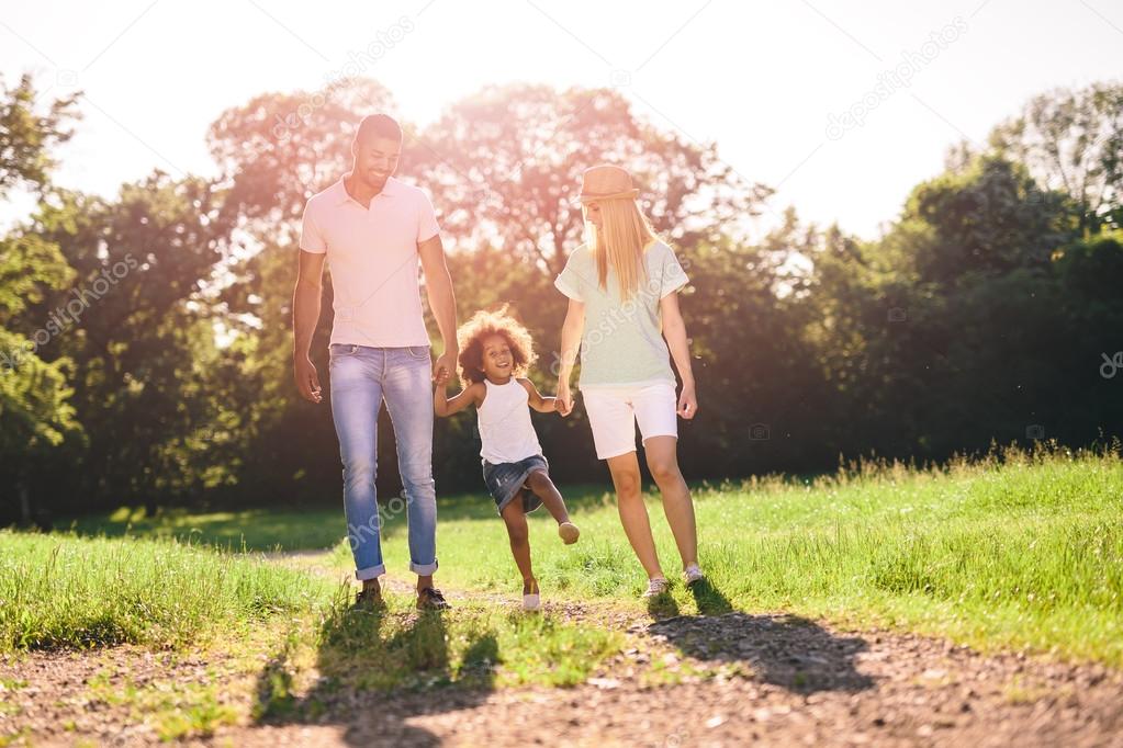 Family taking a walk in nature Stock Photo by ©nd3000 114716406