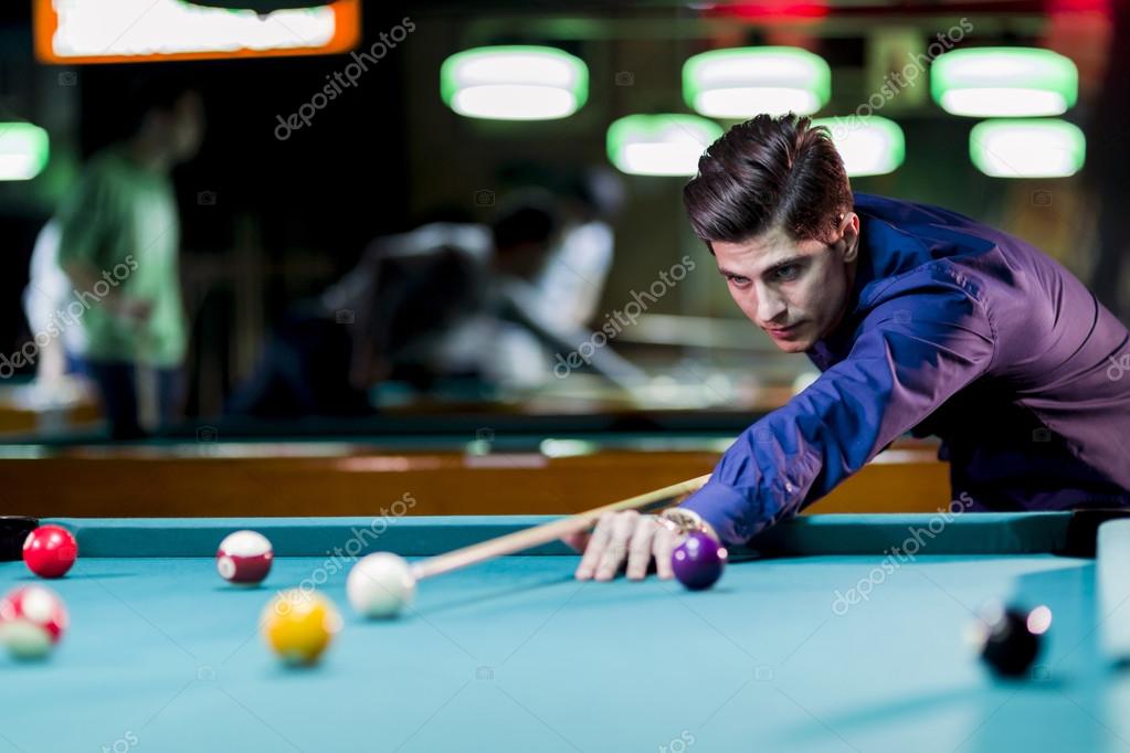 Young handsome man playing snooker — Stock Photo © nd3000 #79188012