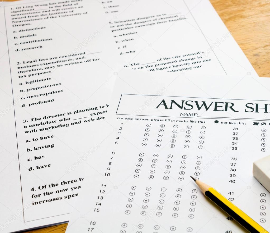 English question and answer sheet on table Stock Photo by ©lamaip 109336886