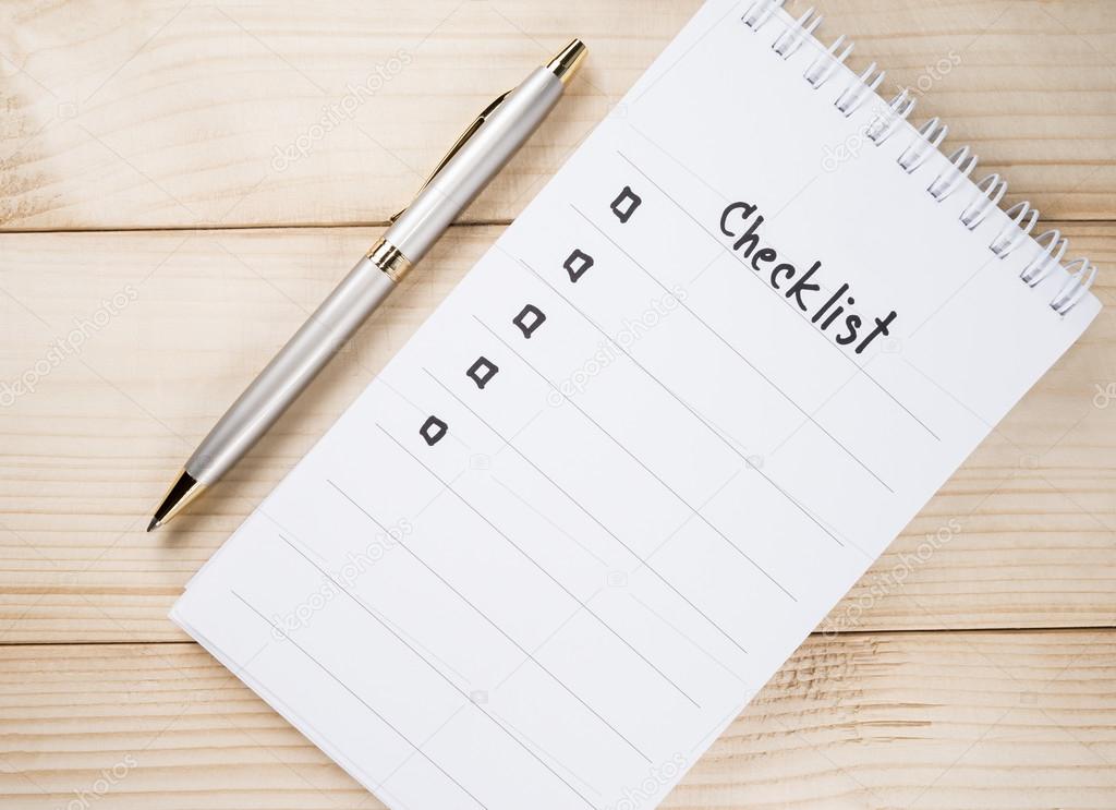 Checklist on notebook 16 Stock Photo by ©npstockphoto 96123602