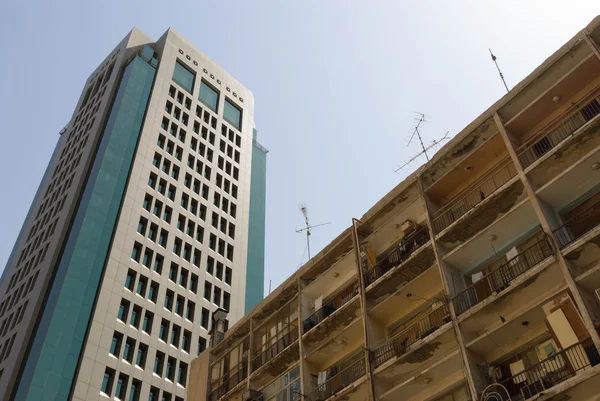 Modern Buildings and Poor Apartments - Stock Image - Everypixel