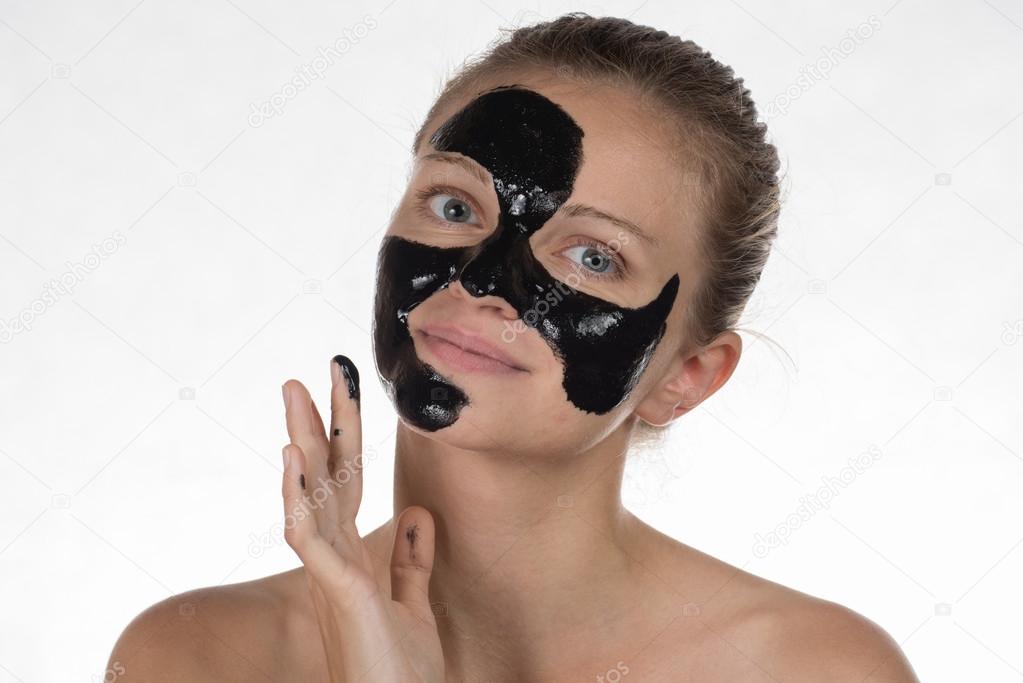 Happy beautiful girl with acne on a white background in a cosmet ...