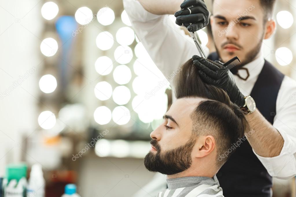 Barber doing haircuts for client Stock Photo by ©VelesStudio 115664746