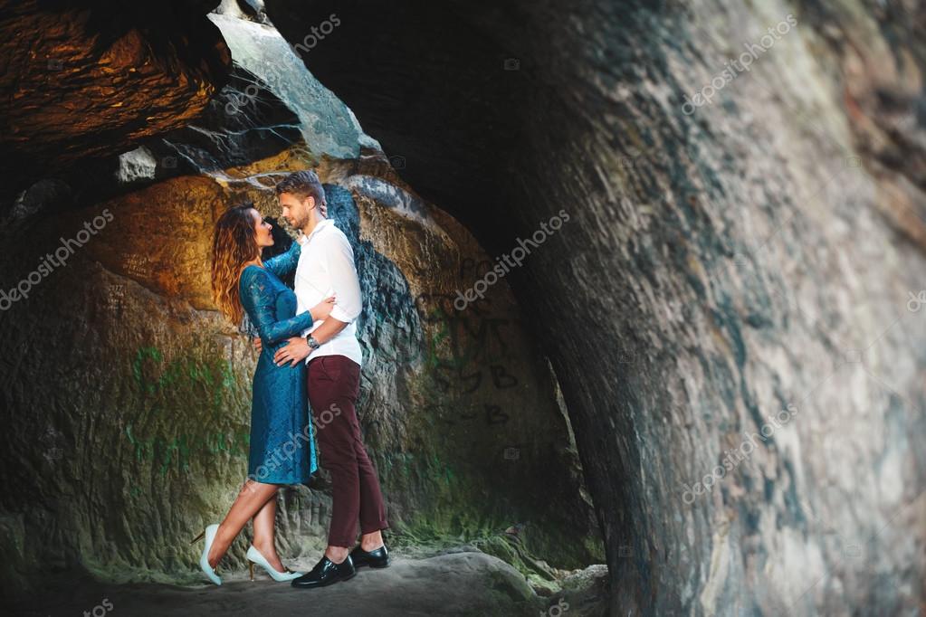 Nice couple in cave Stock Photo by ©VelesStudio 116477350