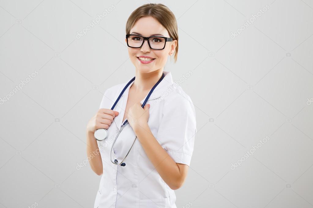 Pretty nurse at studio background — Stock Photo © VelesStudio #124247368