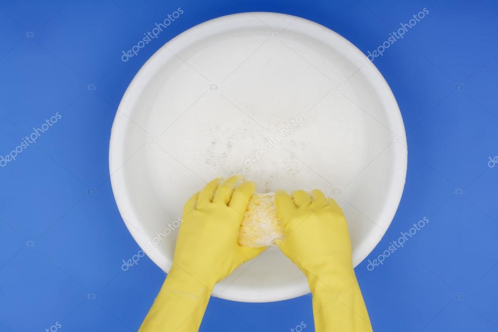 Hands wearing rubber gloves, Wringing out sponge — Stock Photo ...