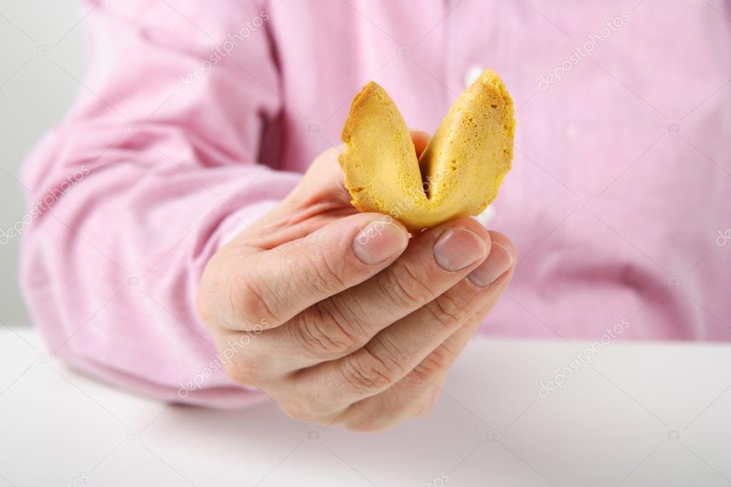 Man with fortune cookies Stock Photo by ©TunedIn61 88186186