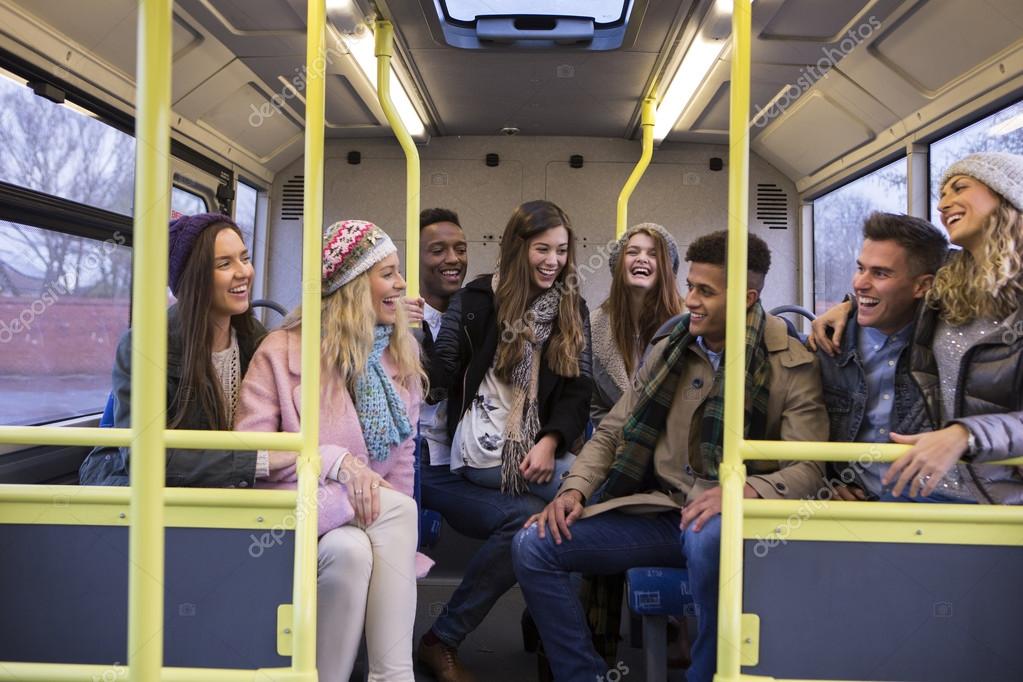 Young people travelling by bus together. — Stock Photo © DGLimages ...