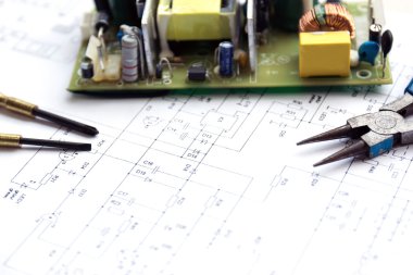Printed circuit board. precision tools and cable of multimeter on ...