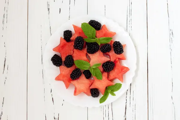 Refreshing watermelon salad with blackberries and mint. Fresh star ...