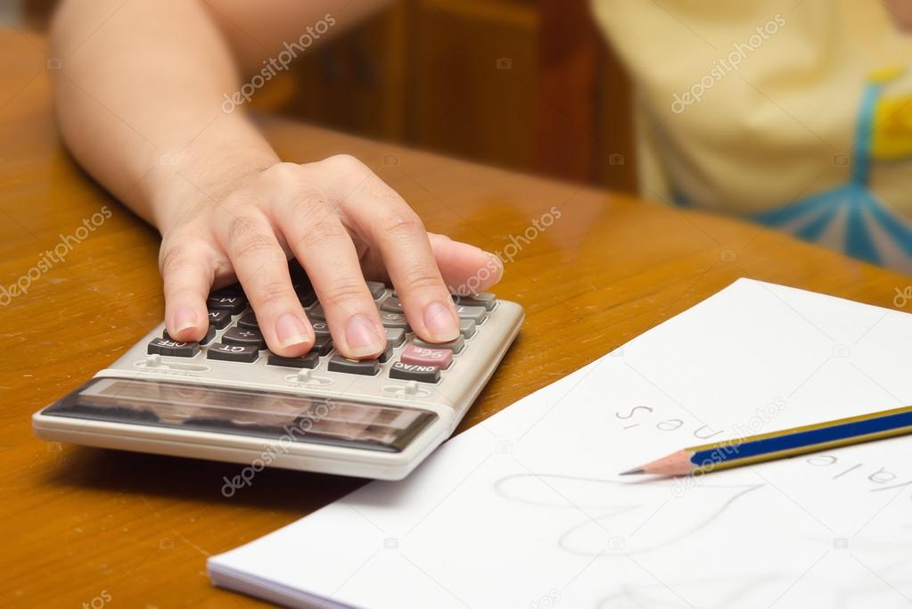 Hand calculates number with calculator background — Stock Photo ...