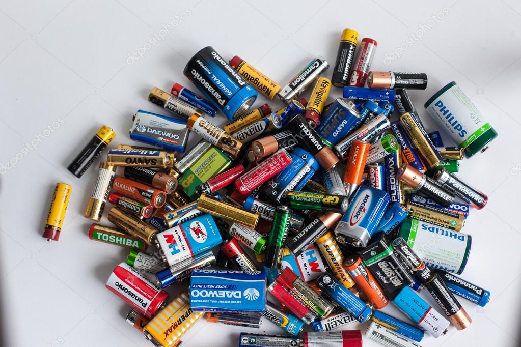 Color batteries of different sizes on a white background isolate ...