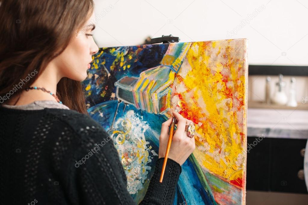 Creative painter paints colorful picture. Closeup Stock Photo by ...