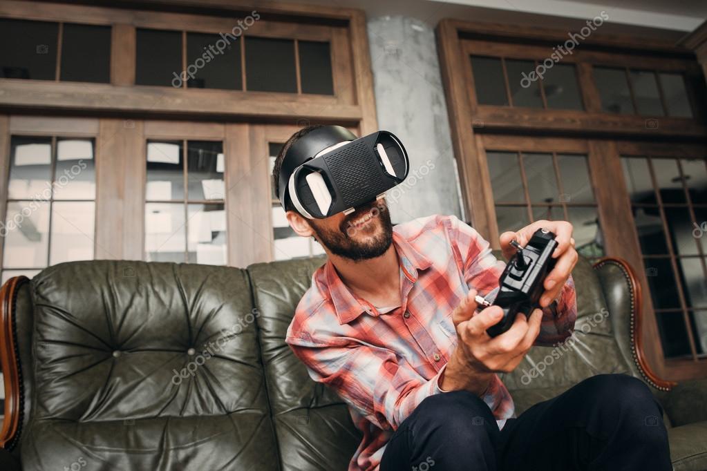 Man playing video games in virtual reality headset — Stock Photo ...