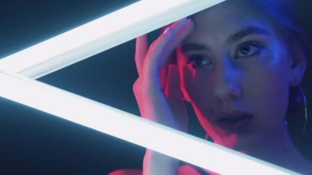 Neon beauty color light face woman touching skin — Stock Video ...