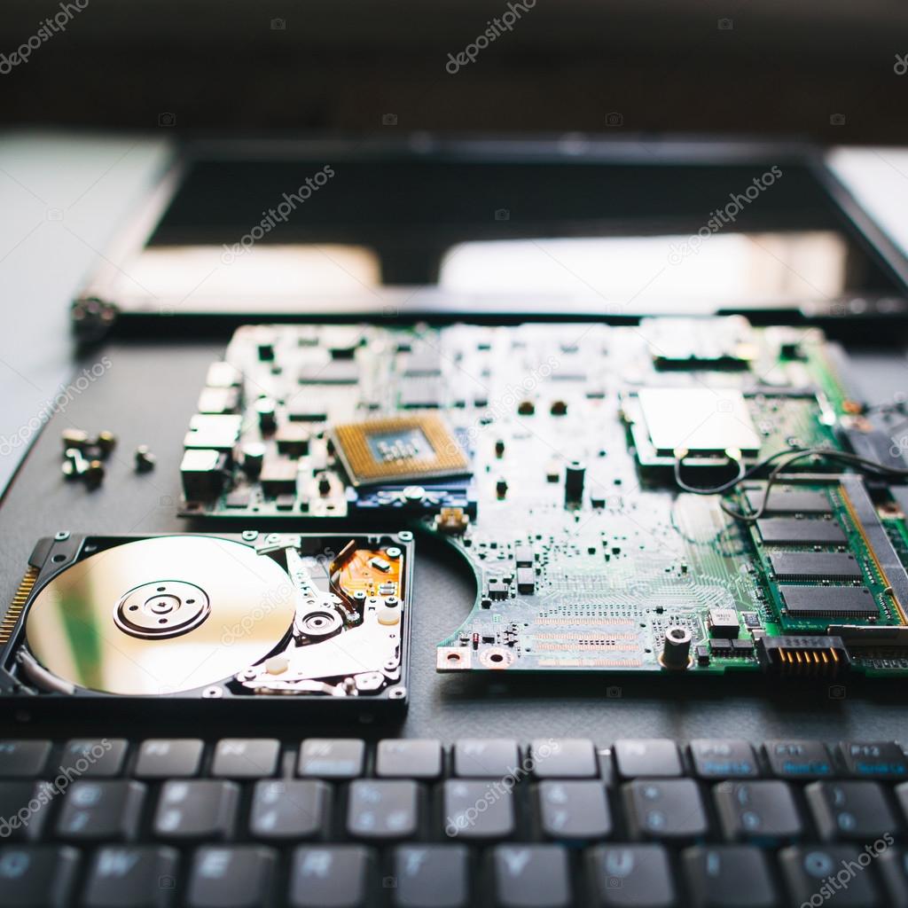 Disassembled computer (laptop) parts: matherboard, hdd, monitor Stock ...
