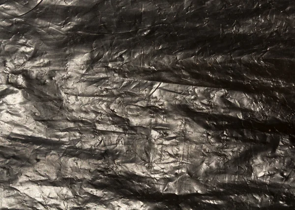 Black plastic bag texture. — Stock Photo © pavelalexeev #109390718