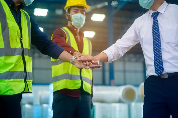 Engineering people are wearing face mask happy in modern factory ...