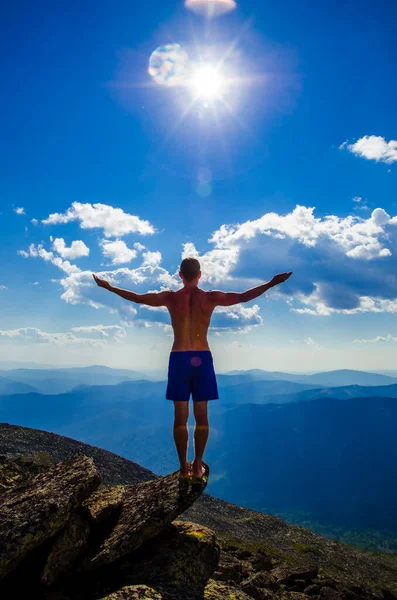 Man On Top Of A Mountain