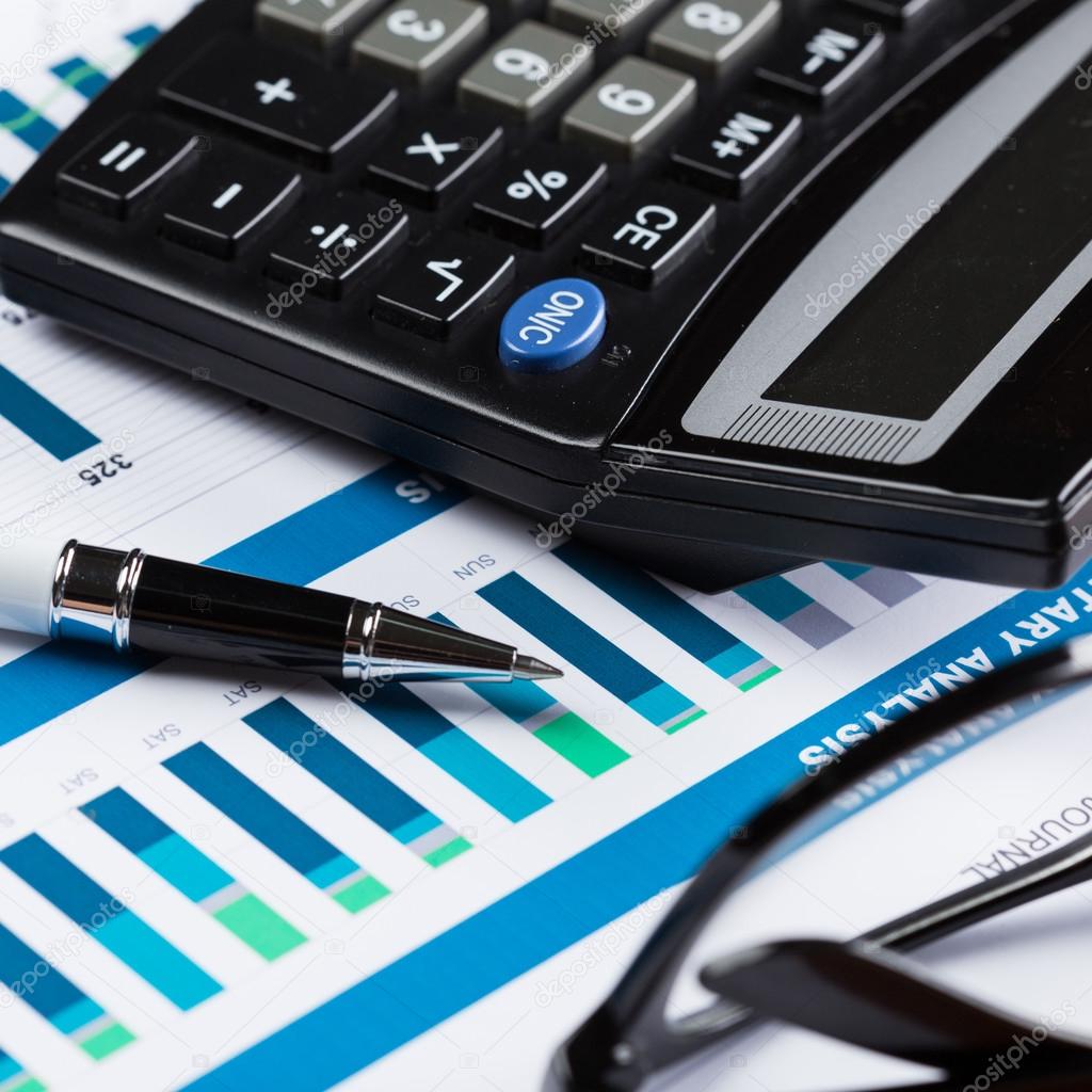 Calculator with financial the numbers and graph — Stock Photo ...