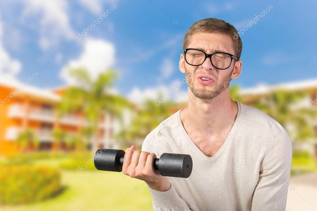 Weak Man Lifting Weights