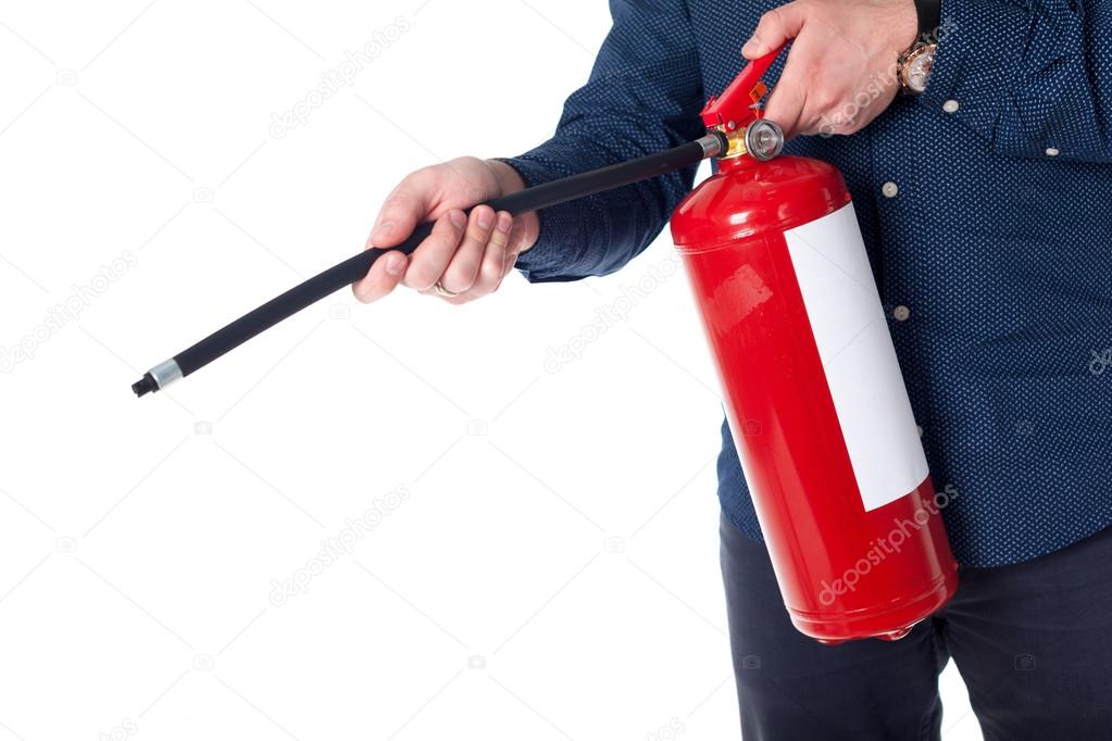 Man using fire extinguisher — Stock Photo © Fotofabrika #110587182