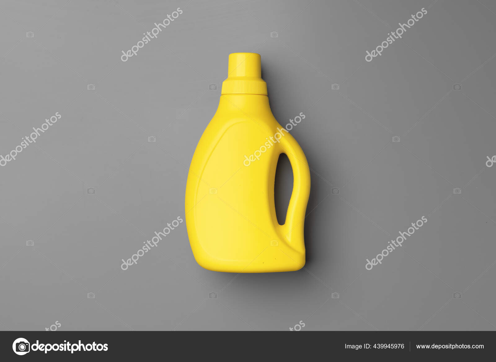 Yellow liquid detergents containers on gray background — Stock Photo ...