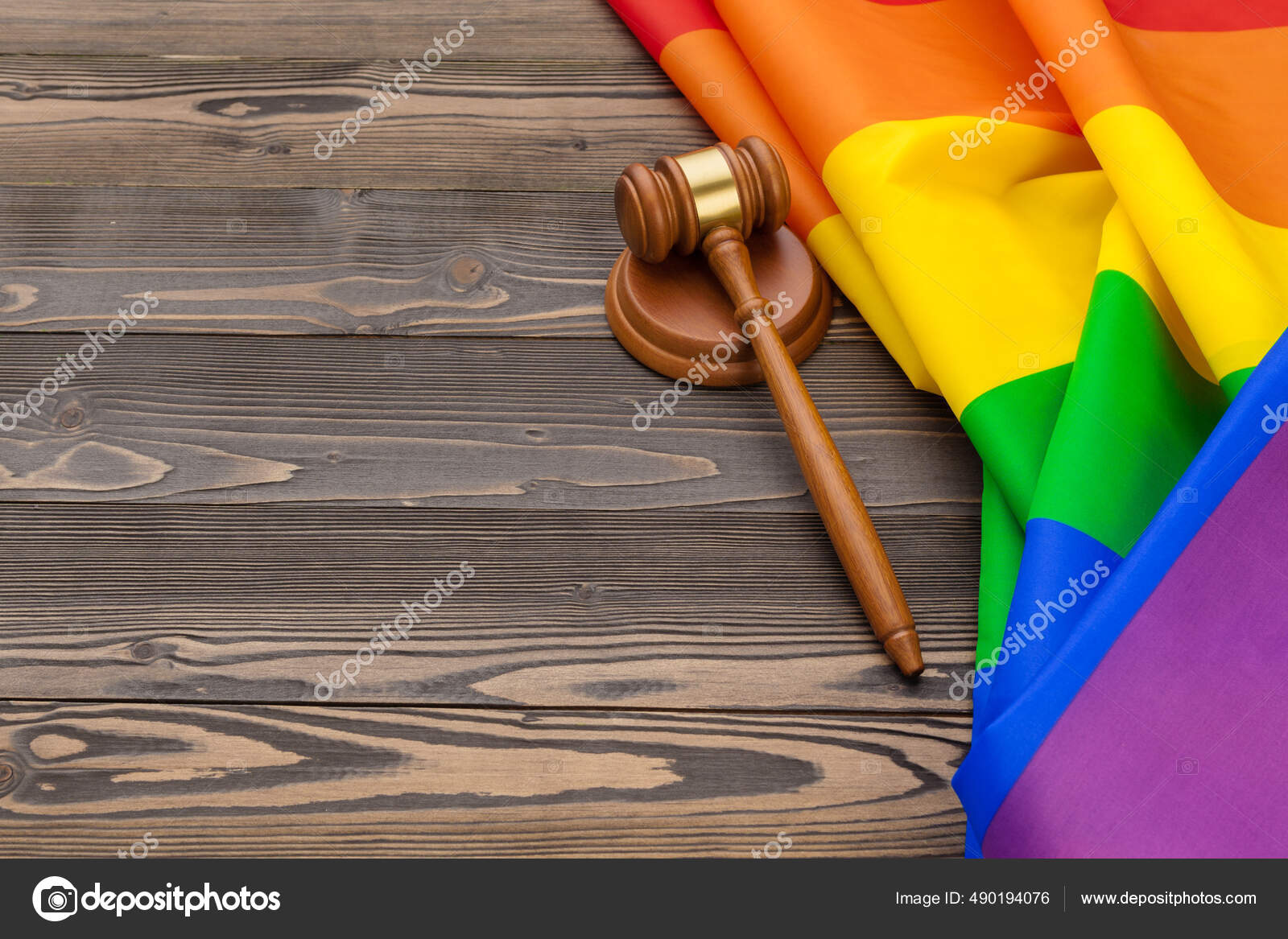 Woden judge mallet symbol of law and justice with lgbt flag in rainbow ...