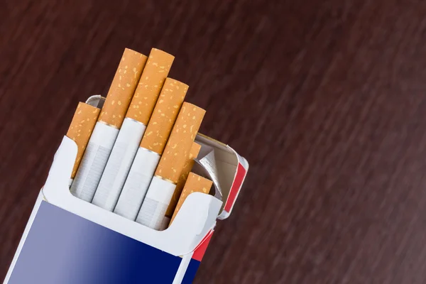 Open pack of cigarettes Stock Photo by ©5seconds 128275978
