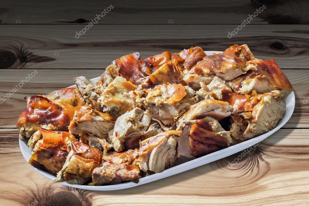 Plateful of Spit Roasted Pork Slices on Wood Background — Stock Photo ...