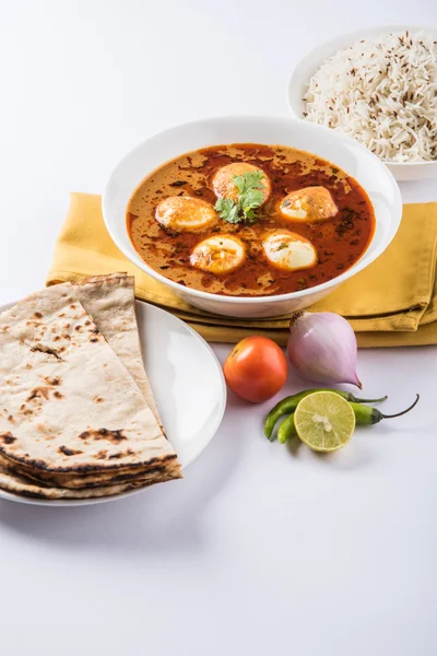 egg curry with roti/chapati and jeera rice, tasty and spicy anda curry ...