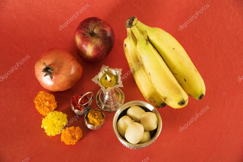 Hindu puja elements, kalash with coconut and mango leaves,diya, haldi ...